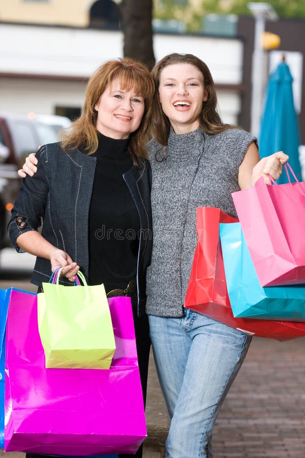 Two Women Shopping stock photo. Image of cheerful, carrying - 8583344