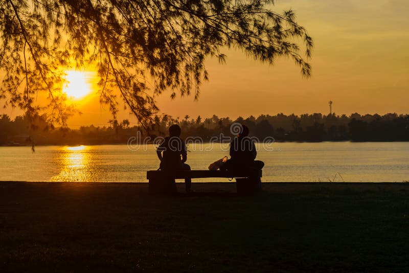 Two Women Sit and Relax Like the Sunrise in the Morning Stock Photo ...