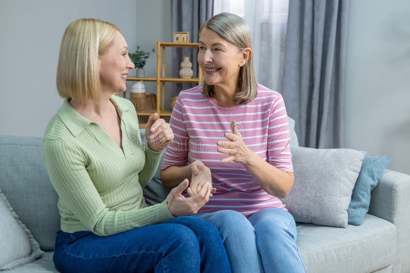Two Women Sitting on the Sofa and Having a Nice Talk Stock Photo ...