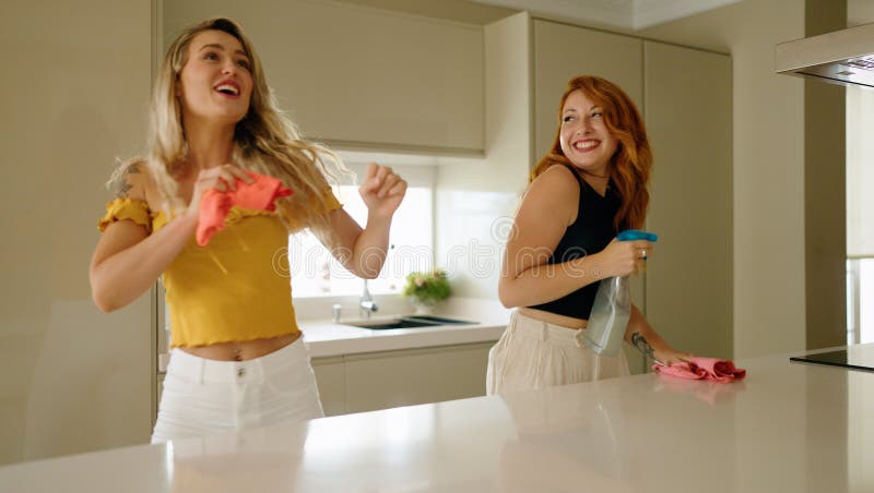 Two Women Smiling Confident Cleaning Table at Kitchen Stock Image ...