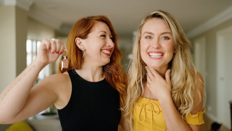 Two Women Smiling Confident Holding Key of New Home at Home Stock Image ...