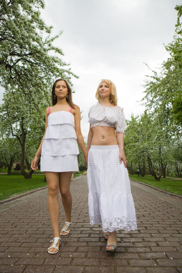 Two women at spring stock image. Image of sunny, blonde - 13810667