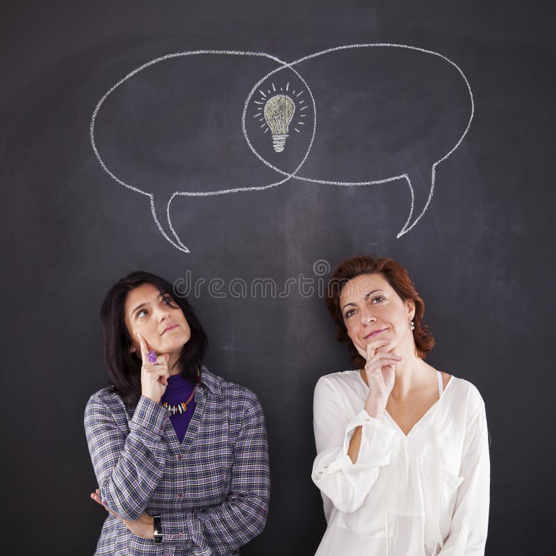 Two Women Stand Side by Side, Their Faces Animated with Inspiration As ...