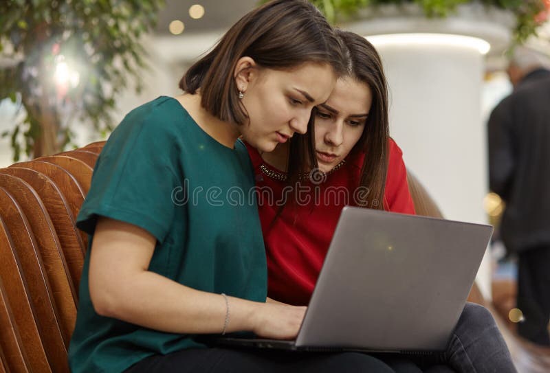 Two Women Students Studying in Open Space with Laptop Computer. Stock ...