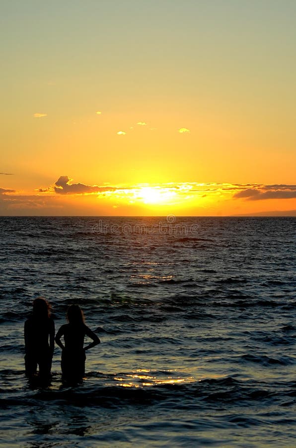 Two women at sunset stock image. Image of women, peace - 1569489