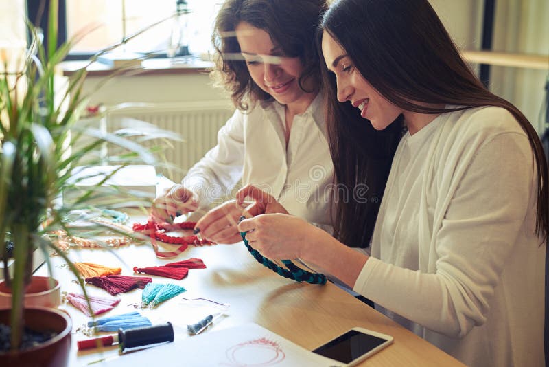 Two Women at the Table Making Jewelry Stock Image - Image of girl ...