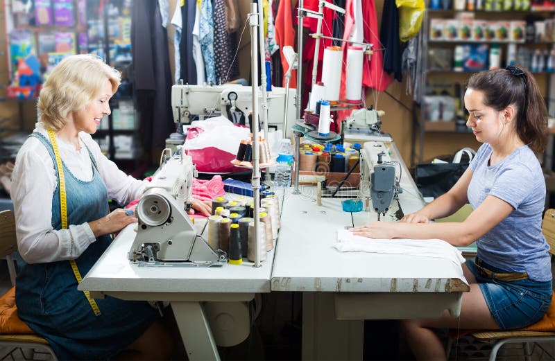 Two Women Tailors Working with Sewing Machines Stock Photo - Image of ...