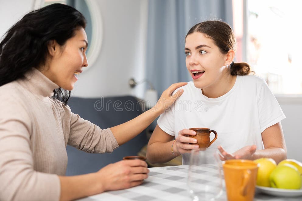 Two Women Talking and Drinking Tea in Apartment Stock Image - Image of ...