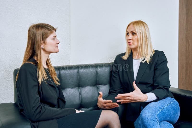 Two Women are Talking on the Sofa Stock Photo - Image of listening ...