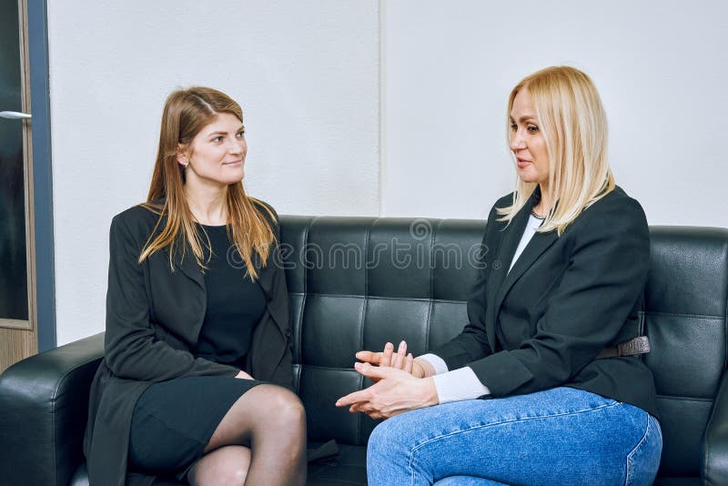 Two Women are Talking on the Sofa Stock Photo - Image of adult ...