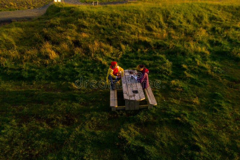 Two Women Tourists Sitting at the Table in Iceland Stock Image - Image ...