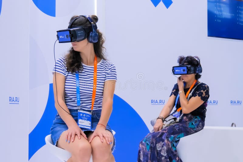 Two Women Using Virtual Reality Headset at VR Technology Exhibition ...