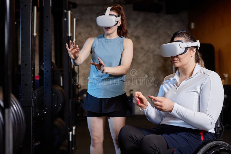 Two Women in VR Training stock image. Image of device - 332068055