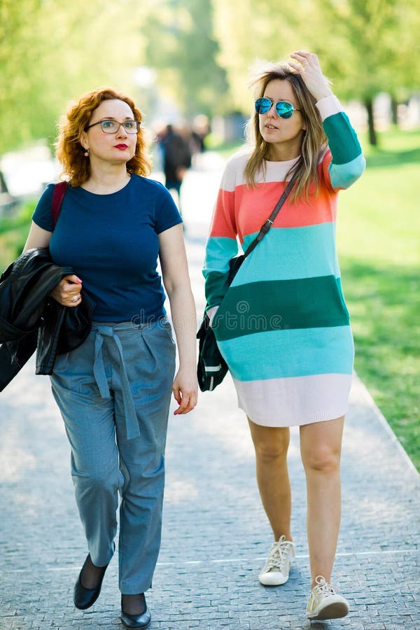 Two Women Walking Together - Having Rest Time Stock Image - Image of ...