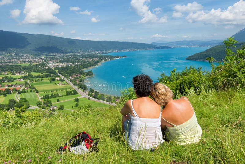 Two Women Watching View of Lake Annecy Stock Photo - Image of alpine ...