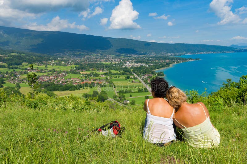 Two Women Watching View of Lake Annecy Stock Photo - Image of savoie ...
