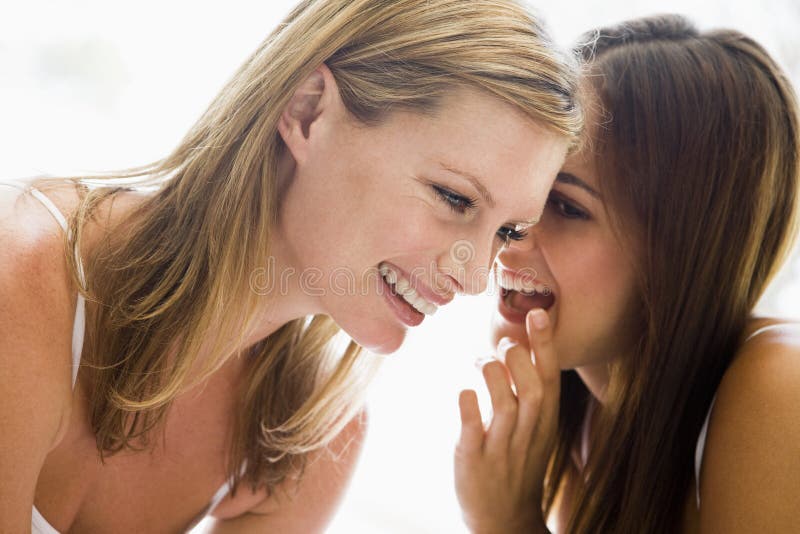 Two Women Whispering and Smiling Stock Photo - Image of sharing ...