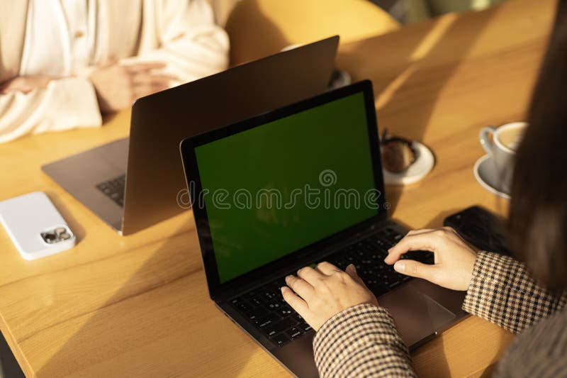 Two Women Work at Laptops Facing Each Other Stock Photo - Image of ...