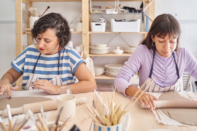 Two Women Working with Clay in a Pottery Workshop. Stock Image - Image ...