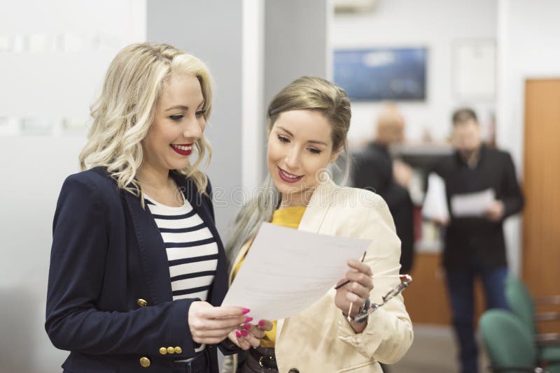 Two Women Working at Office and Talking about Work Stock Photo - Image ...