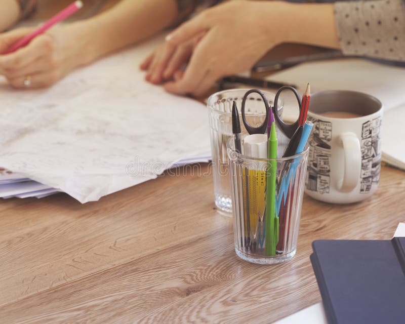 Two Women Working on Some Papers in Their Work Space Stock Image ...