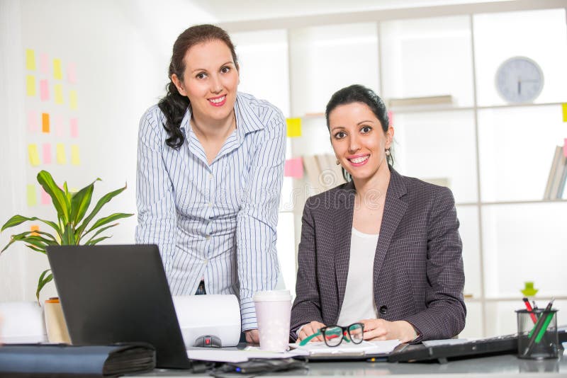 Two Women Working Together in Design Studio. Stock Image - Image of ...