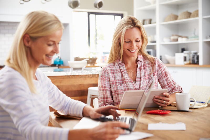 Two Women Working Together at Home Stock Photo - Image of aged, middle ...