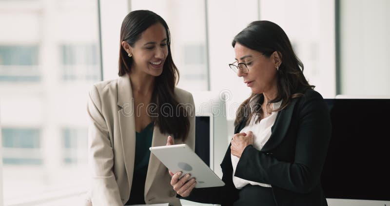 Two Women Workmates Using Tablet Fists Bumping Celebrate Task ...