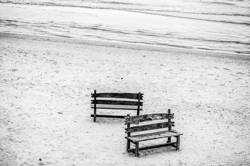 Two Wooden Benches Stand on the Beach with Sand. Stock Photo - Image of ...