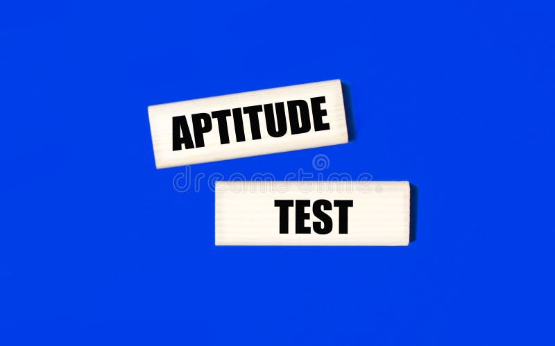 Two Wooden Blocks with the Text APTITUDE TEST on a Blue Background ...