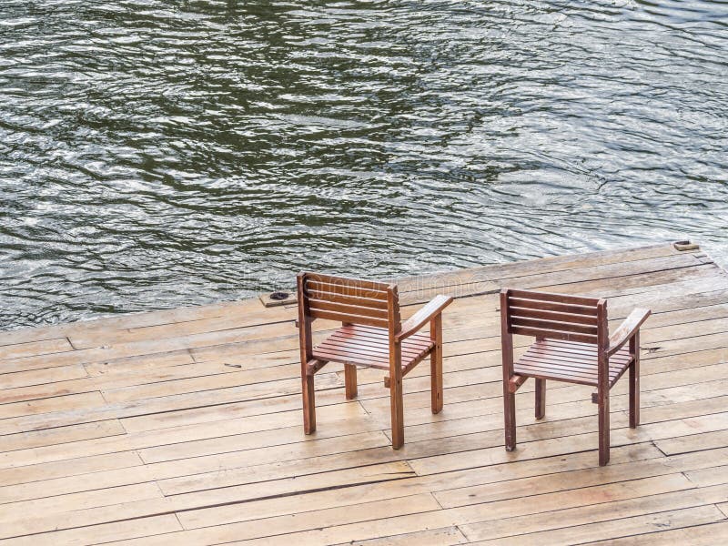 Two Wooden Chairs on Wooden Floor and River Stock Photo - Image of ...