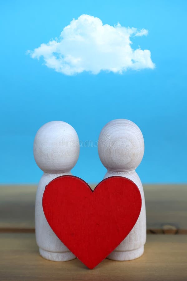 Two Wooden Figures with Red Heart and a Cloud Above Them Stock Photo ...