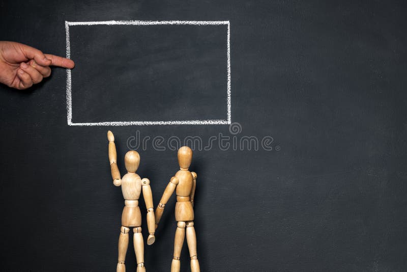 Two Wooden People Stand in Front of a Poster Chalkboard Drawing Stock ...