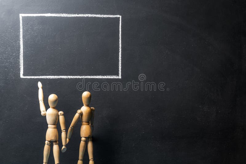 Two Wooden People Stand in Front of a Poster Stock Image - Image of ...