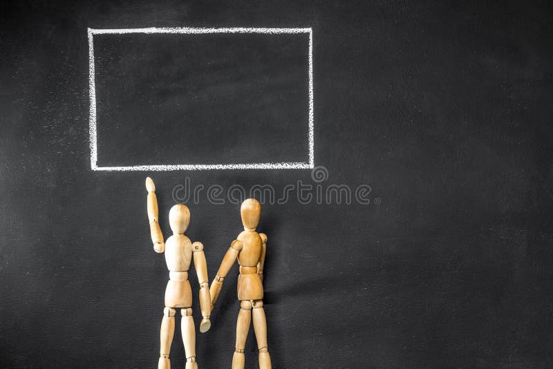 Two Wooden People Stand in Front of a Poster Stock Photo - Image of ...