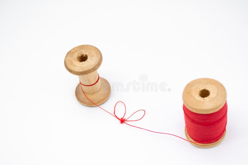 Two Wooden Spools of Thread. One is Full, the Other almost Empty ...