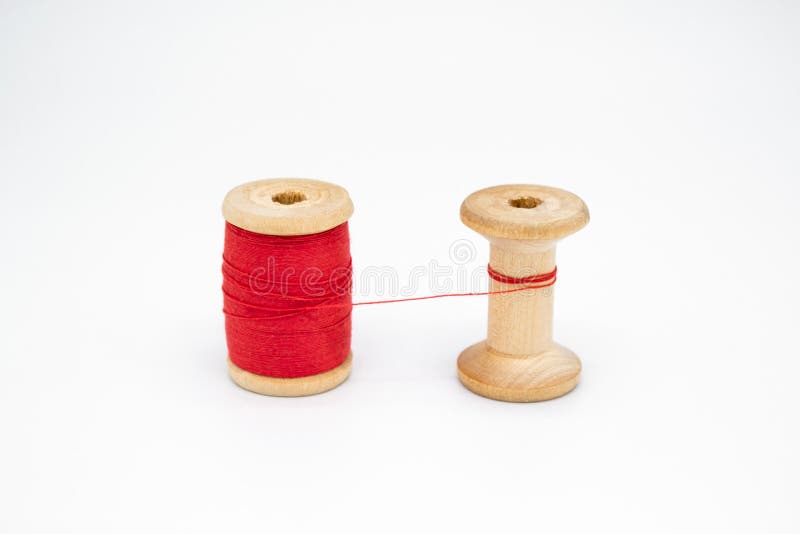Two Wooden Spools of Thread. One is Full, the Other almost Empty ...