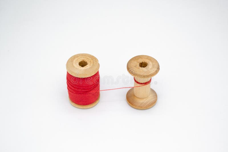Two Wooden Spools of Thread. One is Full, the Other almost Empty ...