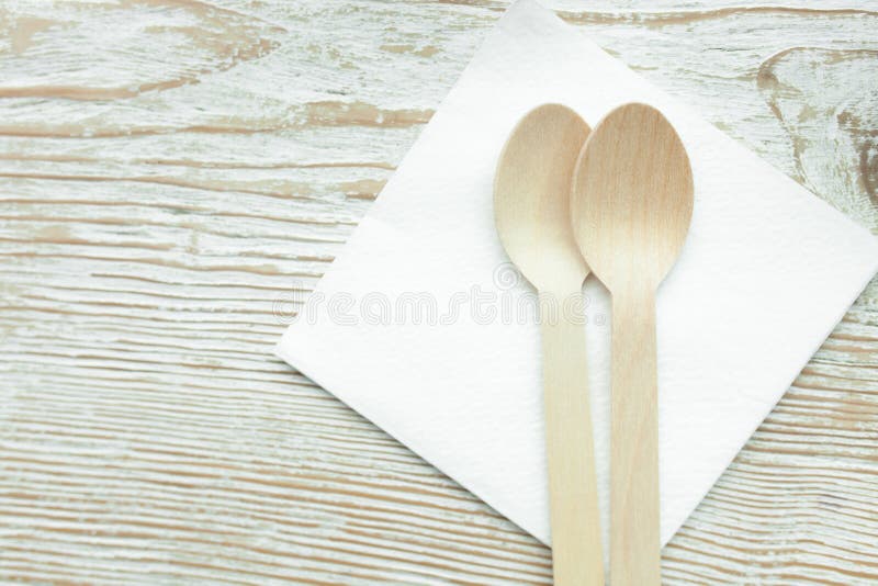 Two Wooden Spoons Lying on a Napkin in a Cafe on Wooden Table Stock ... Two Wooden Spoons Lying on a Napkin in a Cafe on Wooden Table Stock ...