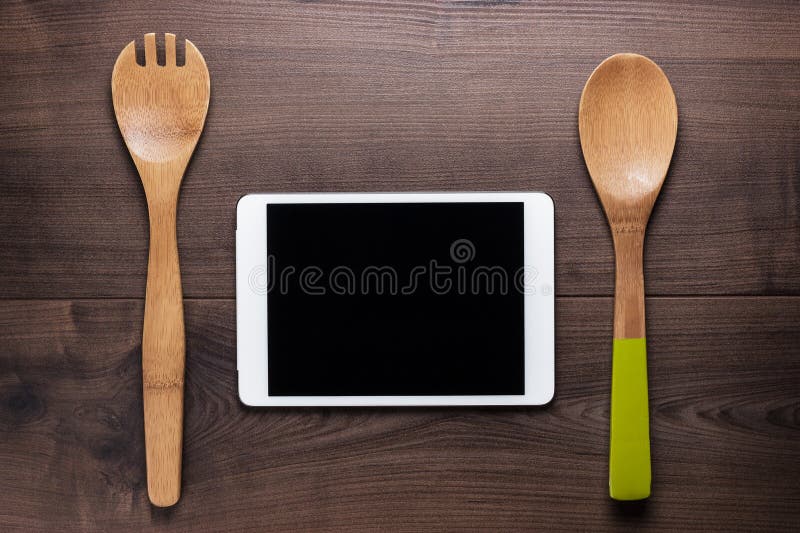 Two Wooden Spoons and Tablet Computer Stock Image - Image of food ...