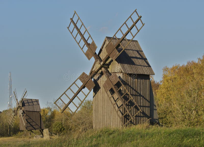 Two wooden wind mills stock photo. Image of trees, summer - 22914764