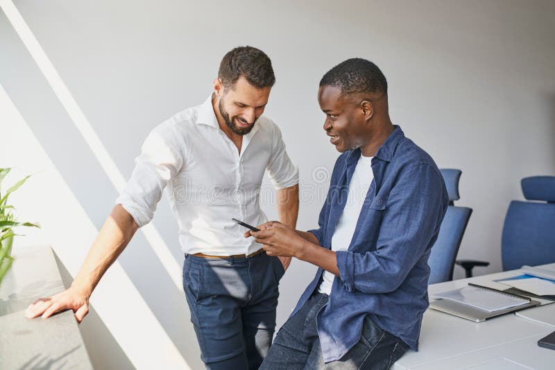 Two Work Colleagues Having Fun during Conversation Stock Photo - Image ...