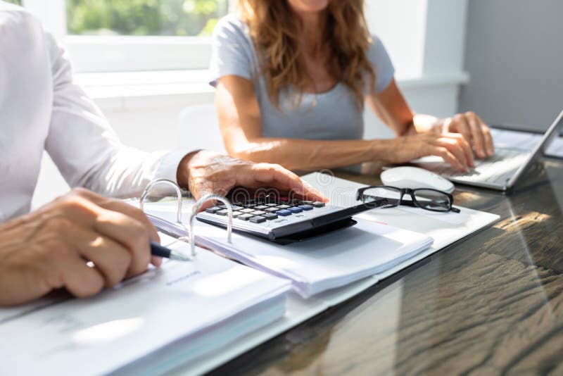 Two Worker Calculating Report in Office Stock Image - Image of ...