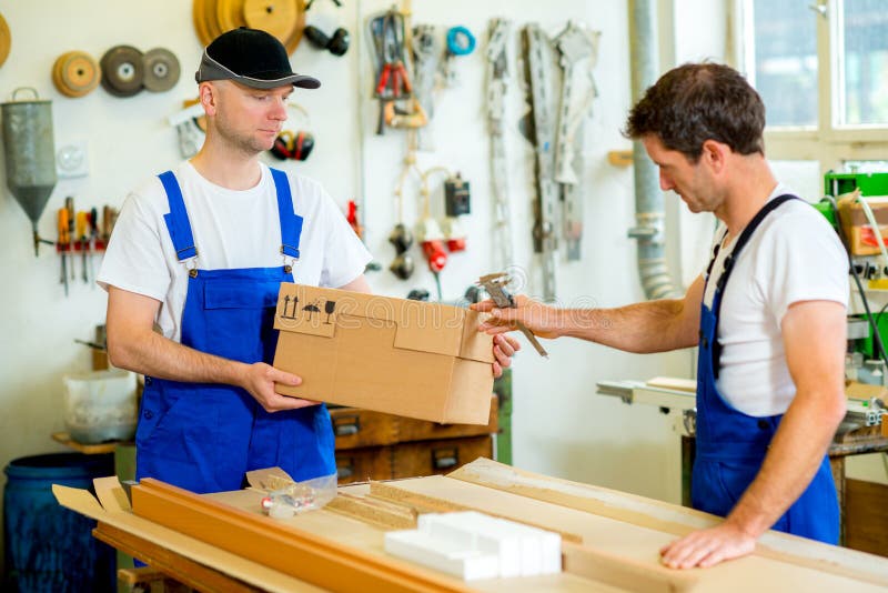 Two Worker with Cardboard in a Carpenter S Workshop Stock Photo - Image ...