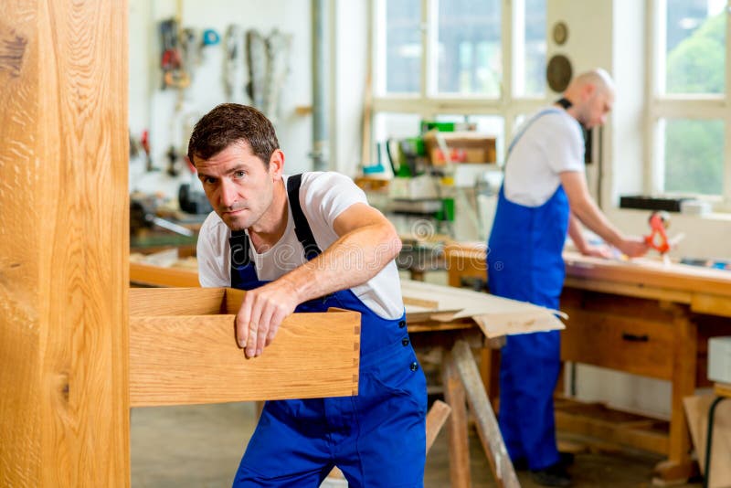 Two Worker in a Carpenter S Workshop Stock Photo - Image of machine ...