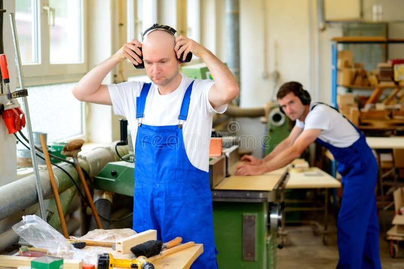 Two Worker in a Carpenter S Workshop Stock Photo - Image of earmuffs ...