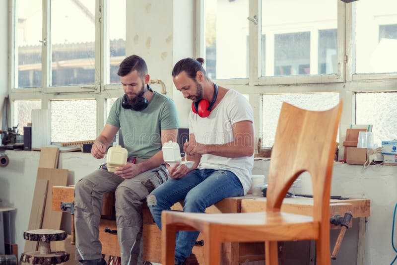 Two Worker in a Carpenter`s Workshop Taking a Break Stock Image - Image ...