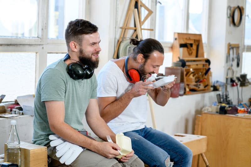 Two Worker in a Carpenter`s Workshop Taking a Break Stock Photo - Image ...