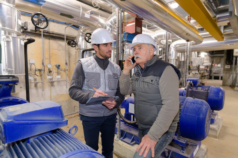 Two worker in factory stock image. Image of equipment - 151238415