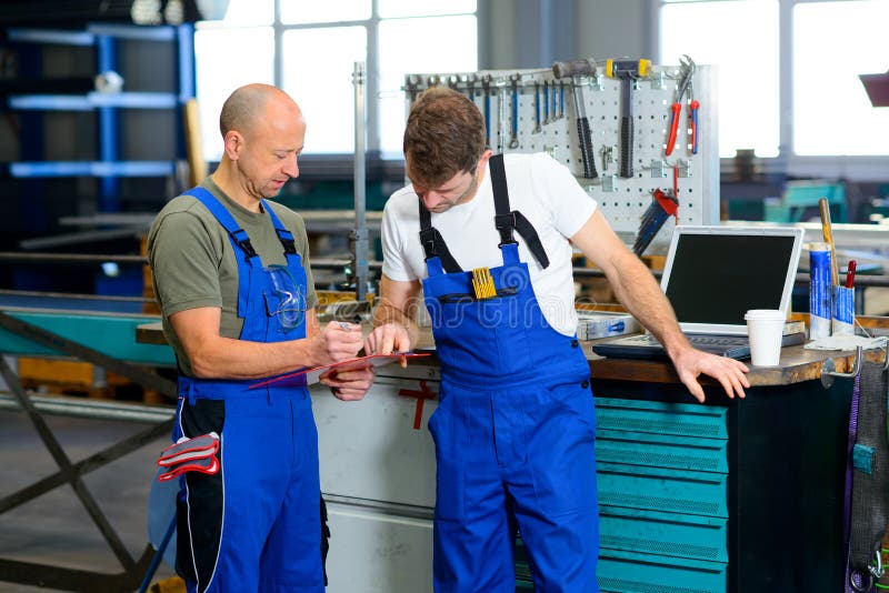 Two Worker in Factory in Conversation Stock Photo - Image of caucasian ...